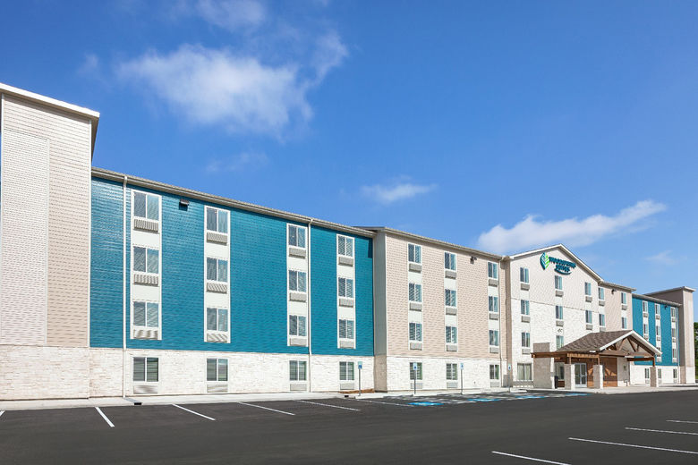 Now Open: WoodSpring Suites Dallas Plano Central Legacy – Plano, Texas ...